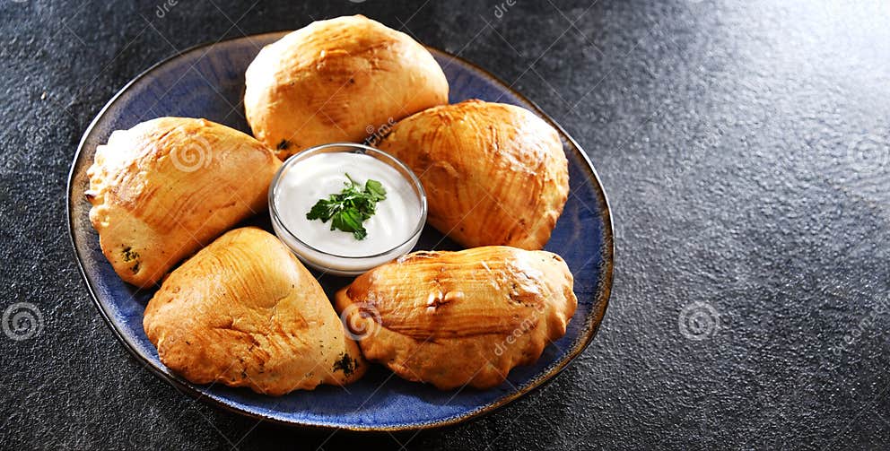 Composition with a Plate of Oven-baked Pierogi Stock Photo - Image of ...