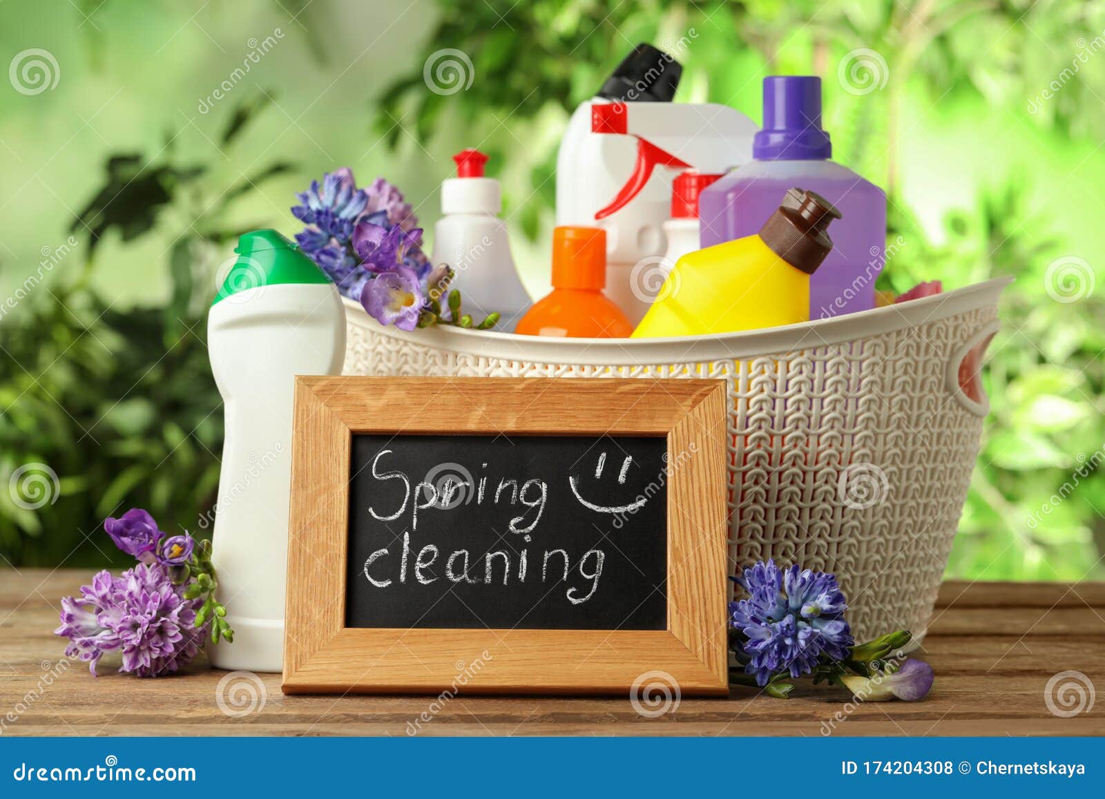 Composition with Spring Cleaning Sign, Flowers and Detergents on Wooden ...