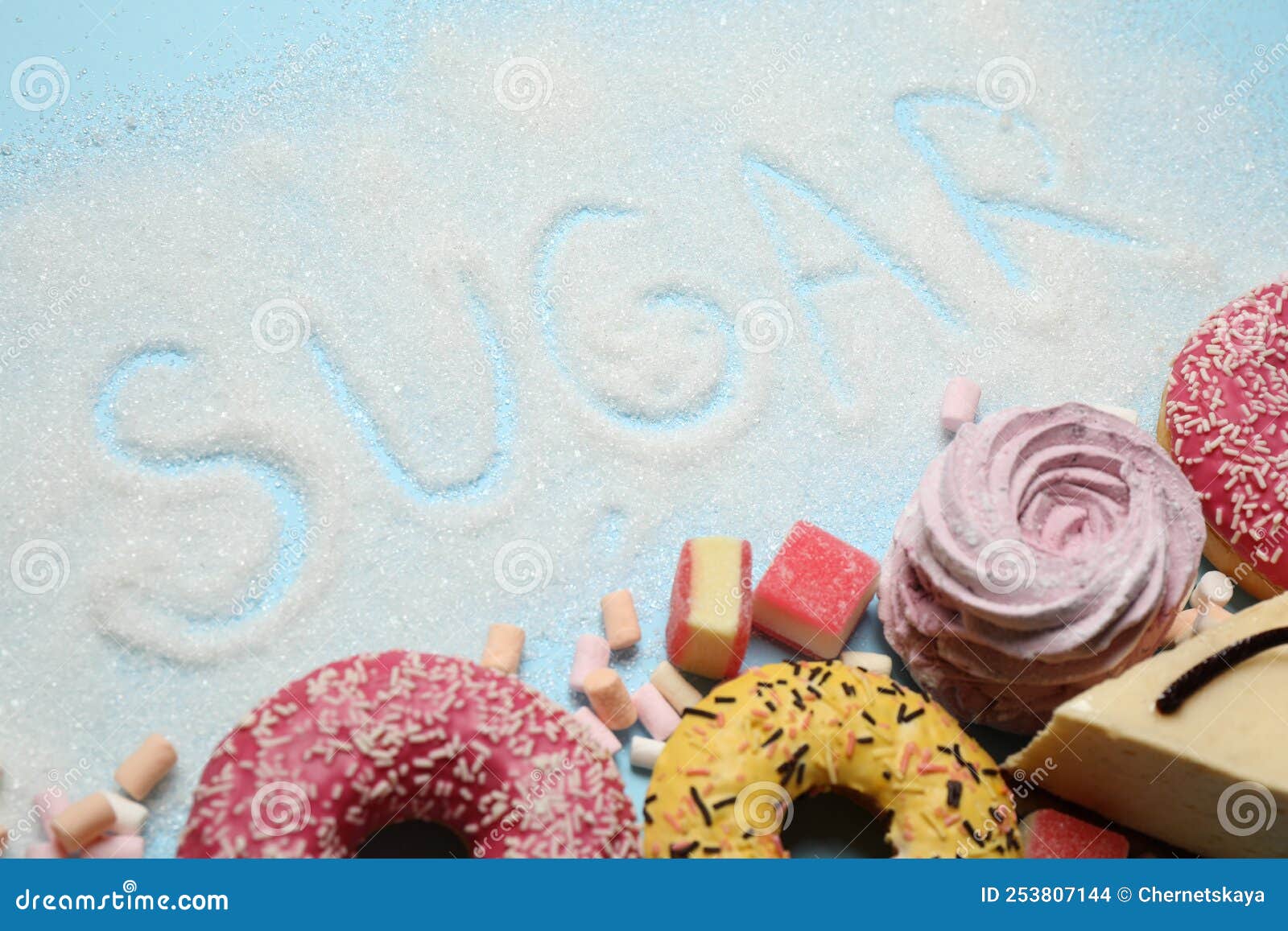 Composition with Sweets and Word SUGAR on Light Blue Background Stock ...