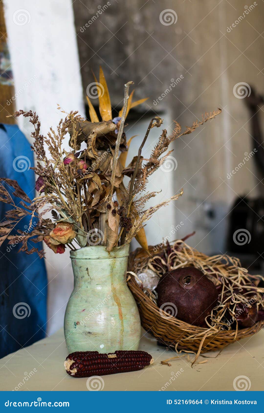 Composition of a Vase, Withered Flowers, Pomegranate in a Basket and a ...