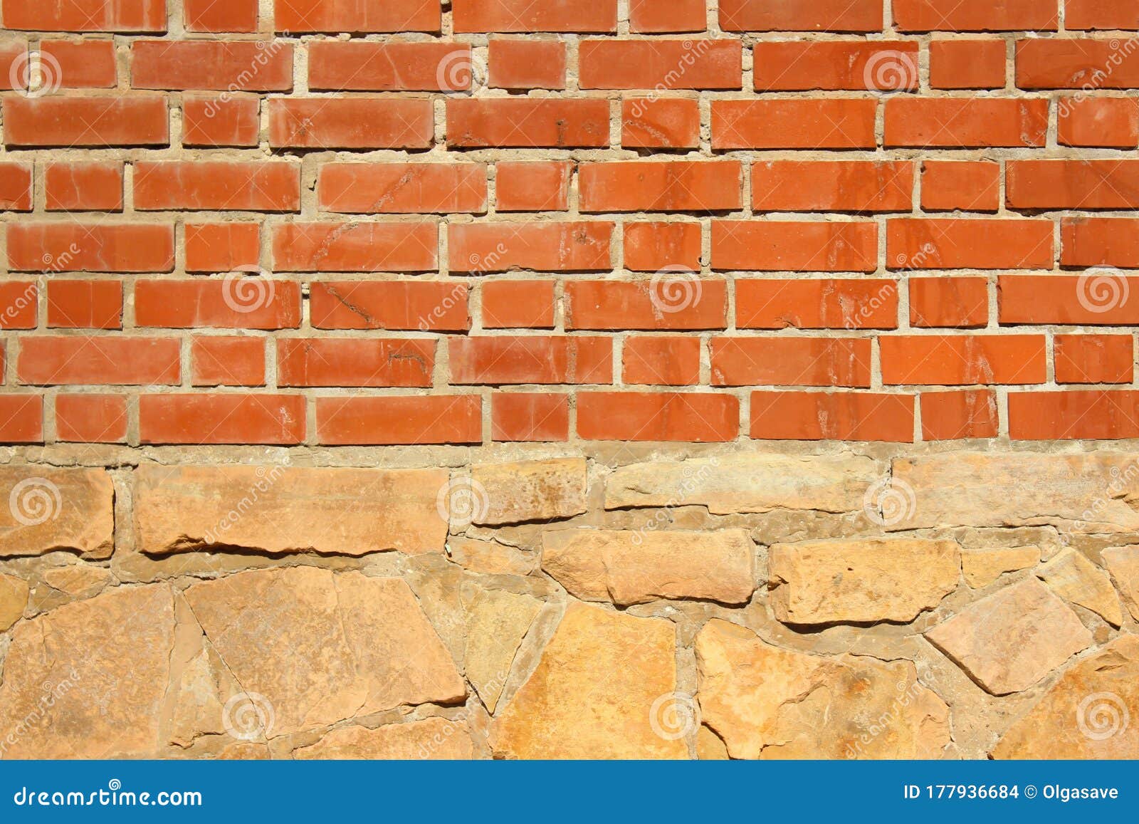 Compound of Bricks and Rocks in Facade. Red Brick Wall Over Rock ...