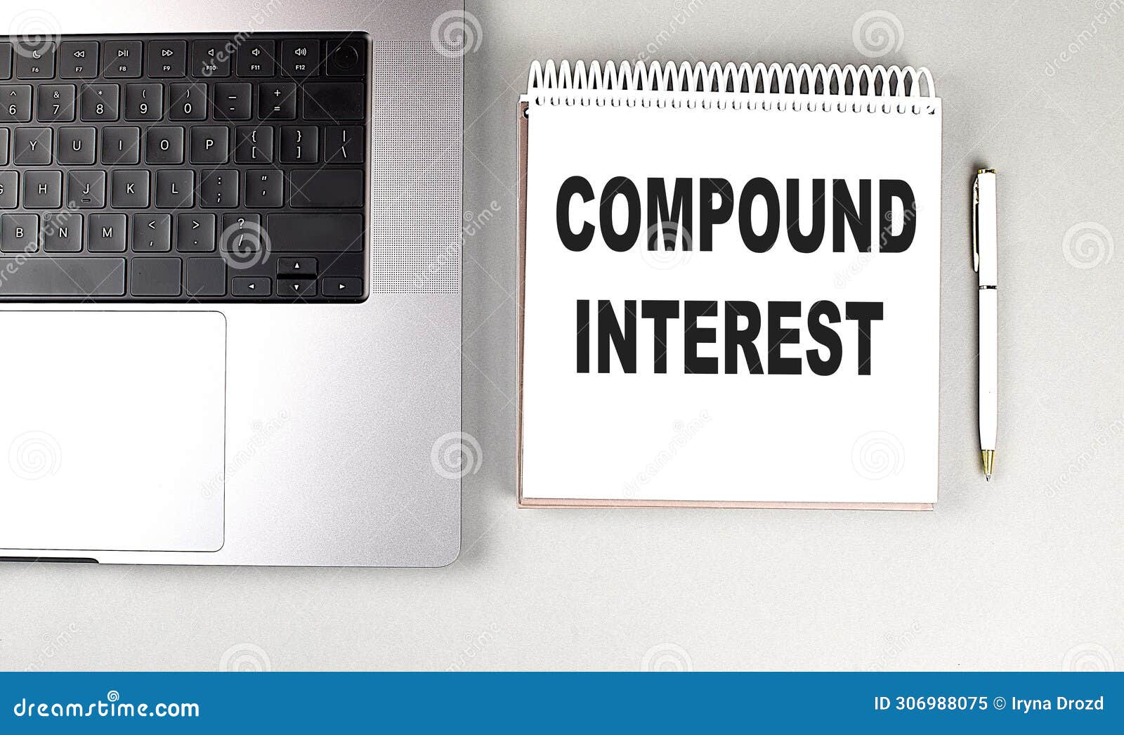 COMPOUND INTEREST Text on Notebook with Laptop and Pen Stock Image ...