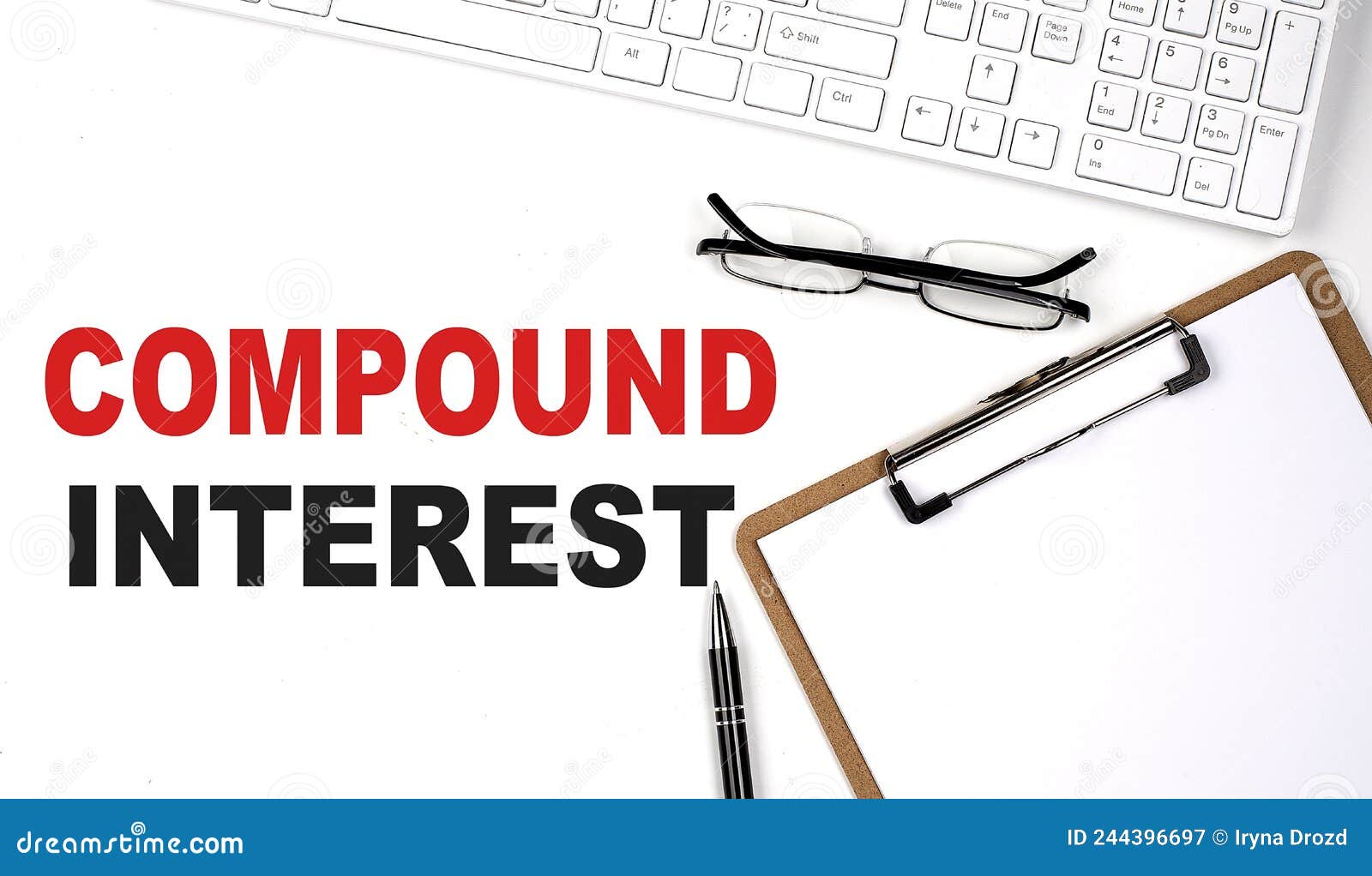 COMPOUND INTEREST Text Written on the White Background with Keyboard ...