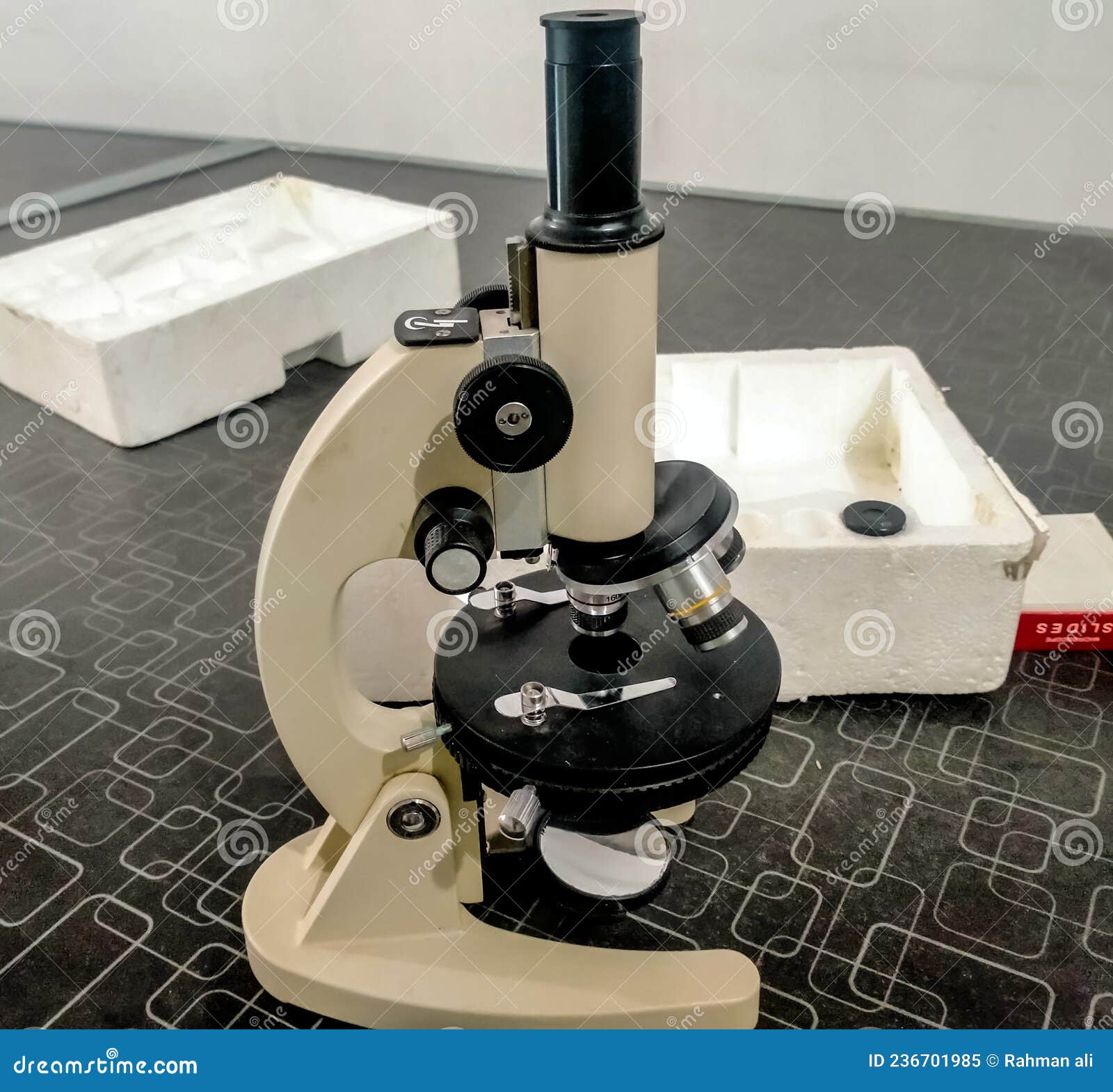 A compound microscope. stock image. Image of furniture - 236701985