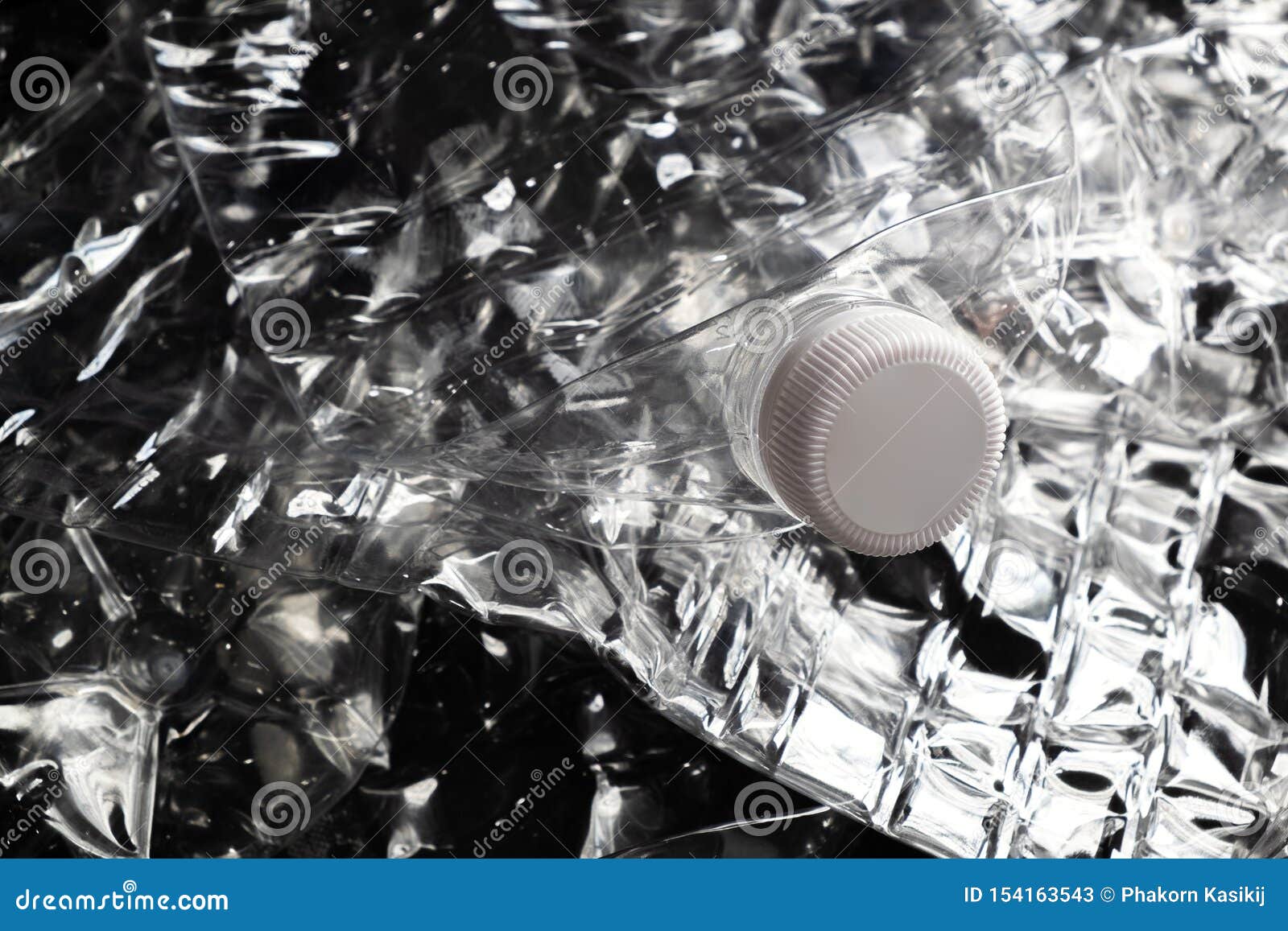 Compressed Plastic Drinking Water Bottle on ISolated Black Background ...