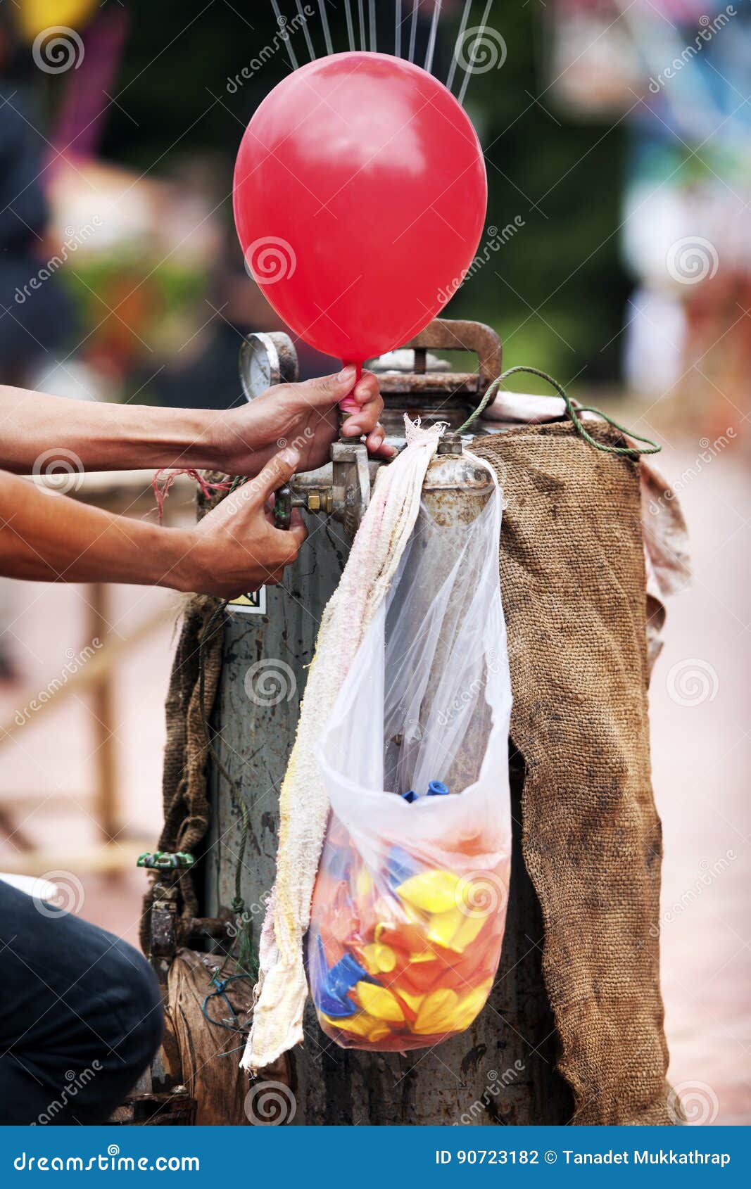 Compressing gas to balloon stock photo. Image of arms - 90723182