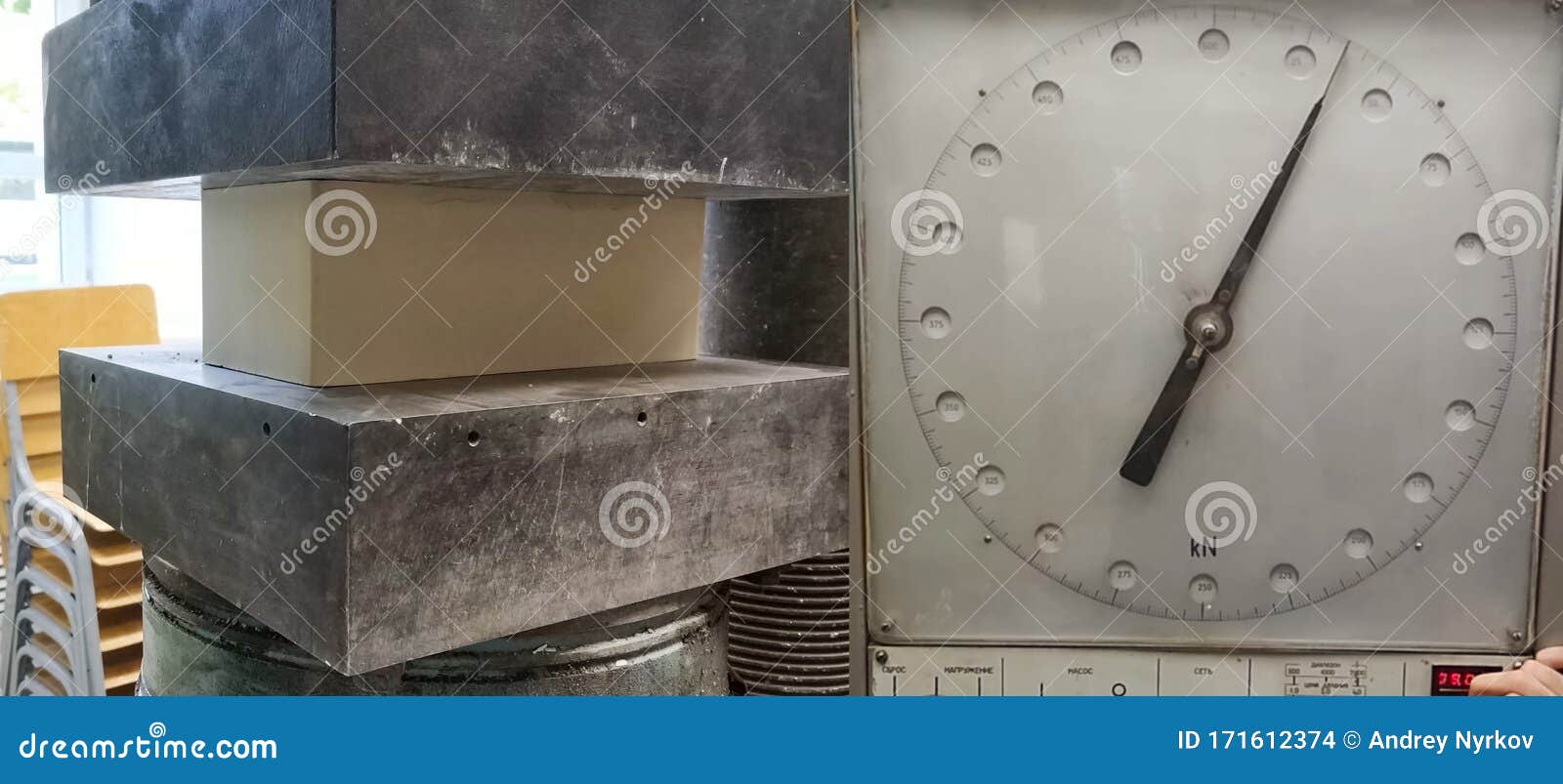 Compression Strength Test of a Brick in Press. Pressure Indications of ...