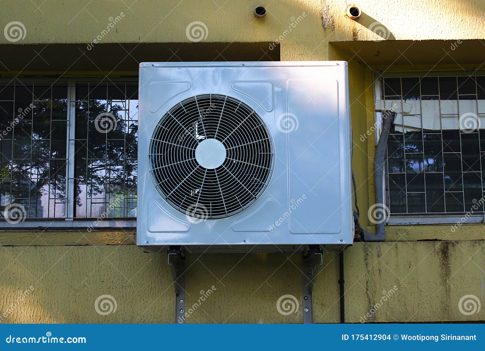 A Compressor of Air Conditioner Placed on the Wall Stock Photo - Image ...