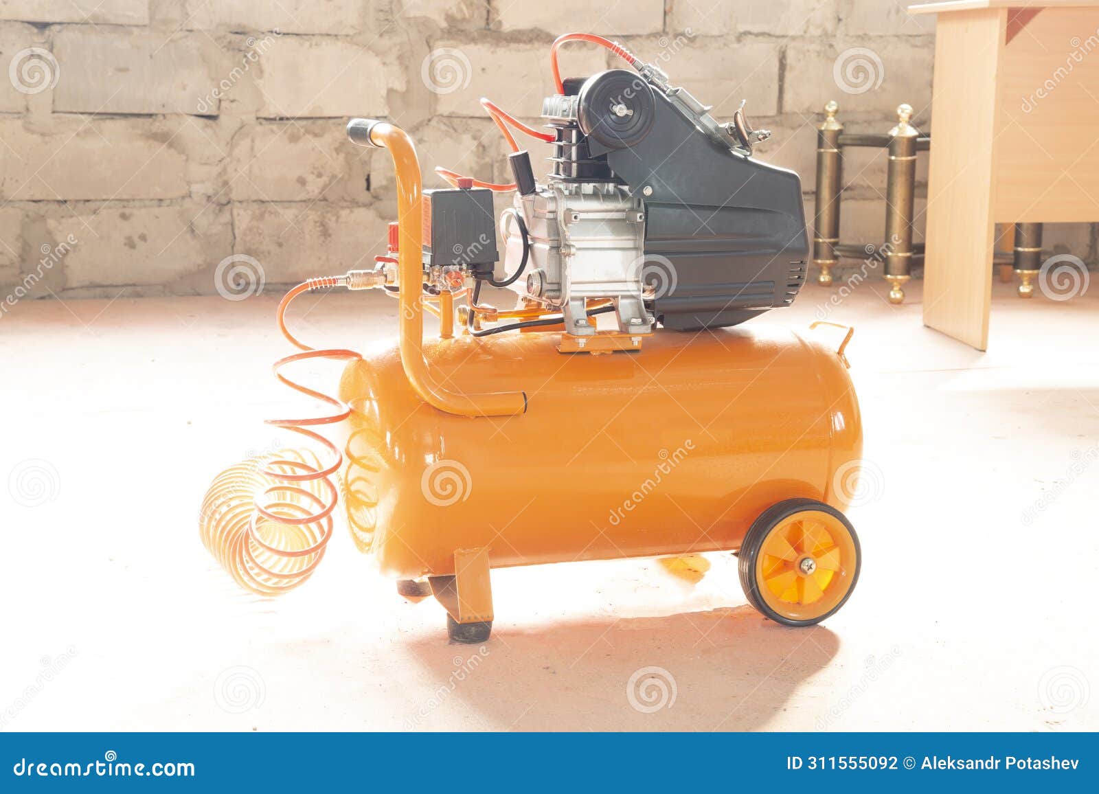 The Compressor is Portable.Using a Portable Compressor at Work Stock ...