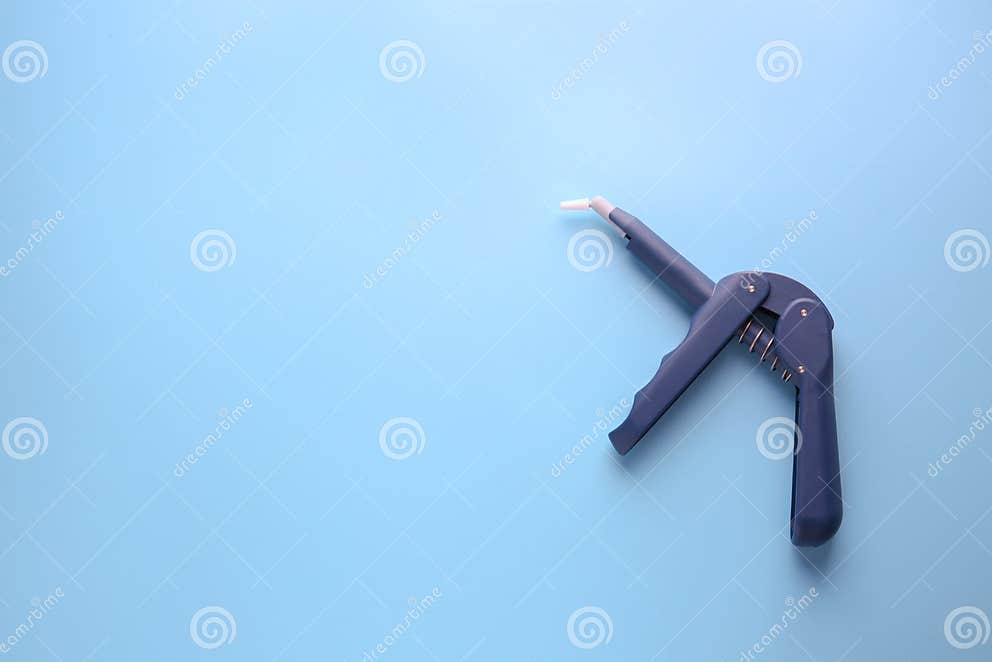 Compule Tip Gun on Color Background Stock Photo - Image of background ...