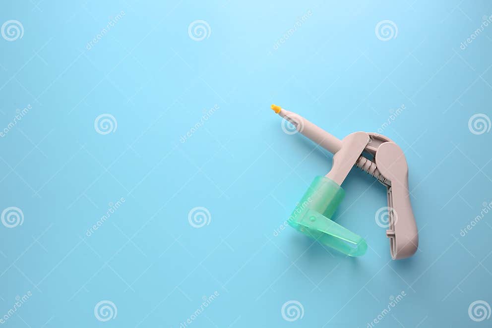 Compule Tip Gun on Color Background Stock Photo - Image of base ...