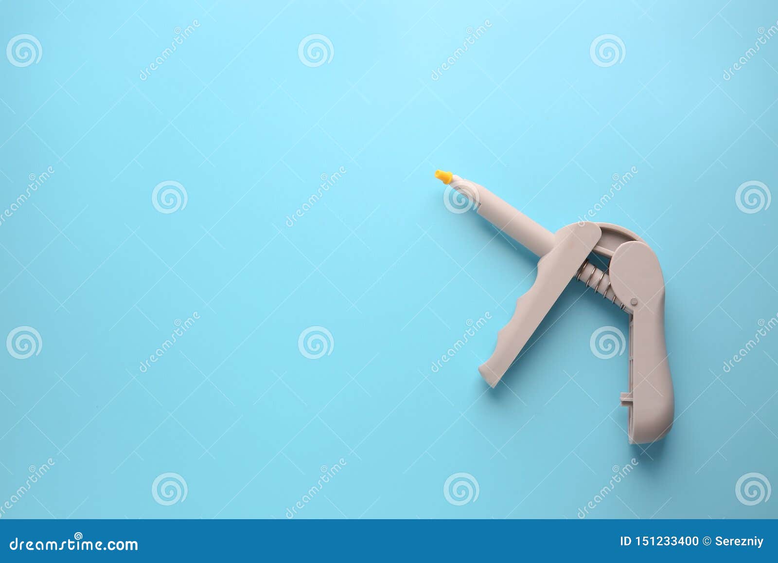 Compule Tip Gun on Color Background Stock Photo - Image of posterior ...