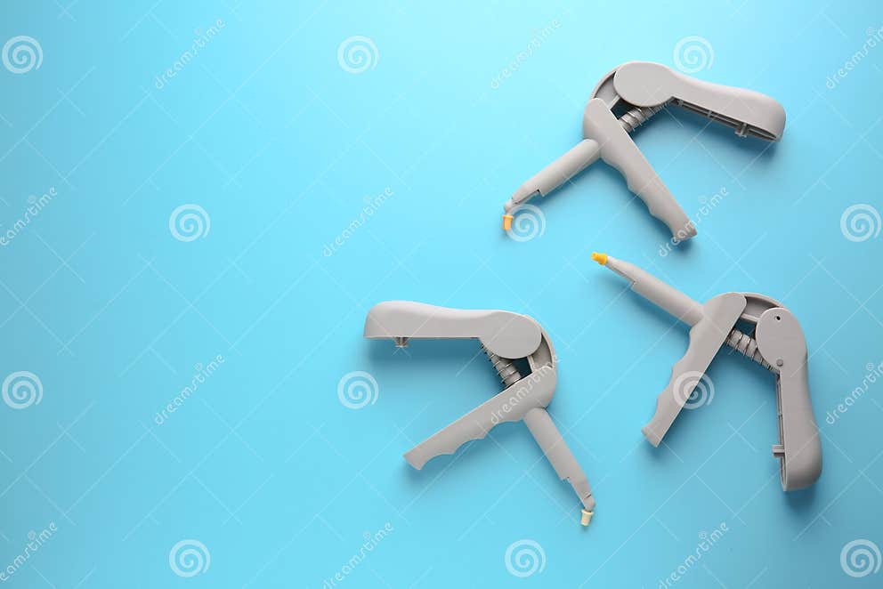 Compule Tip Guns on Color Background Stock Photo - Image of filling ...