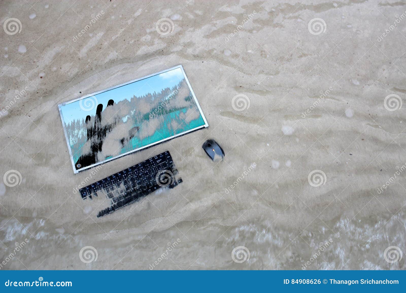The Computer on a Beach with a Hand Images on the Screen. Stock Photo ...