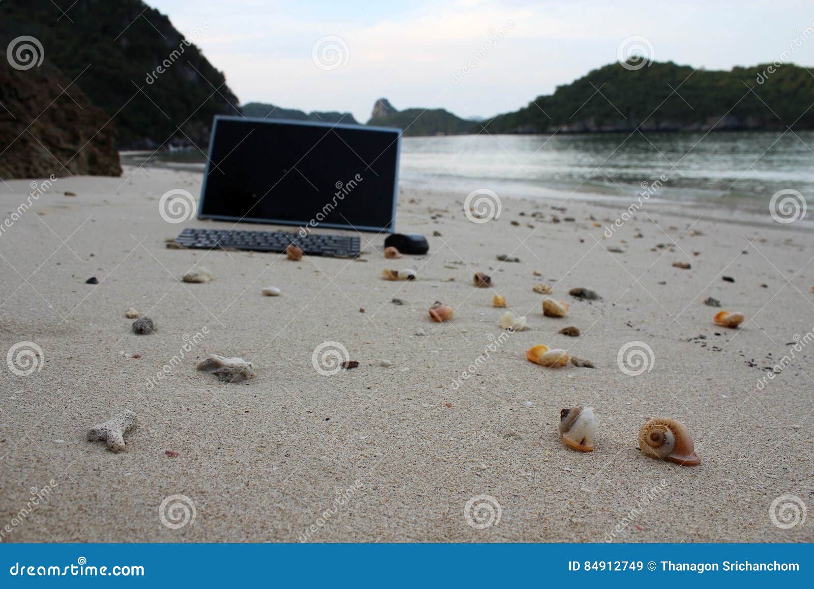 The computer on the beach. stock image. Image of display - 84912749