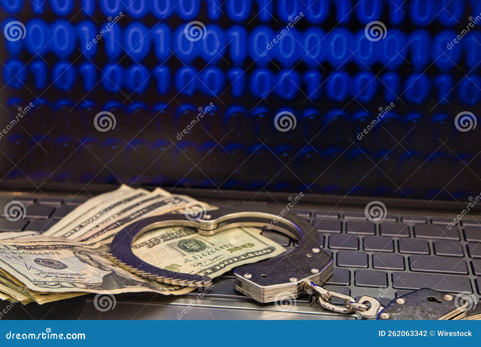 Computer with Binary Data on the Screen, Handcuffs and Money on the ...