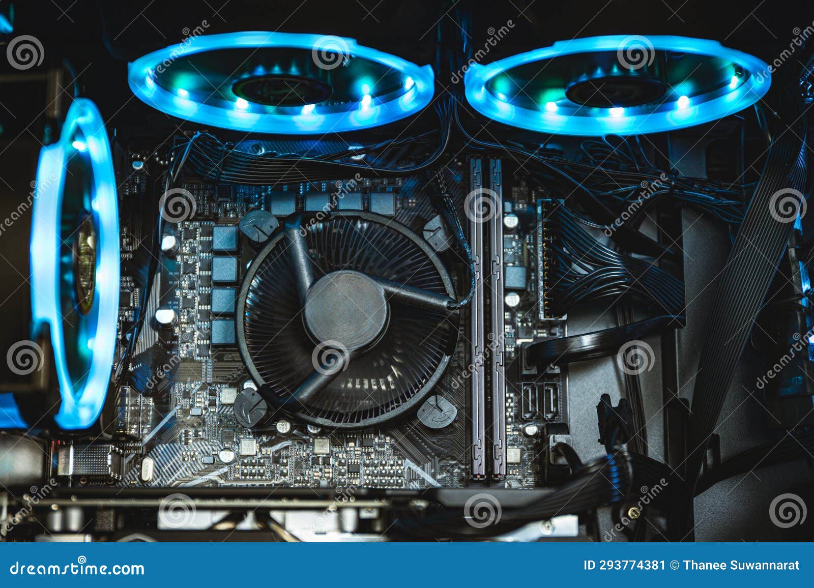 Computer Circuit Board and CPU Cooling Fans Illuminated by Internal LED ...