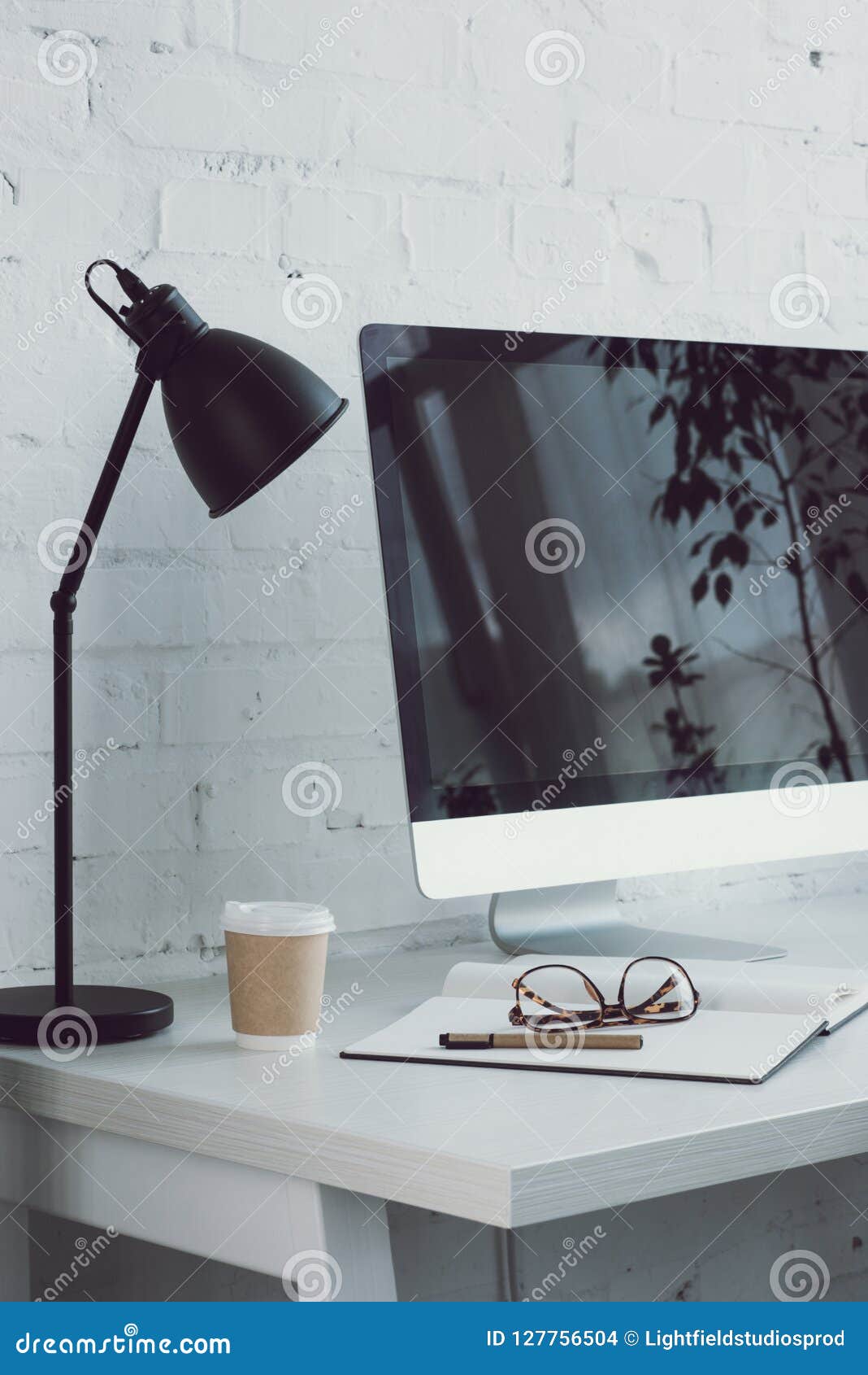 Computer and Coffee in Paper Cup on Table in Modern Workspace Stock ...