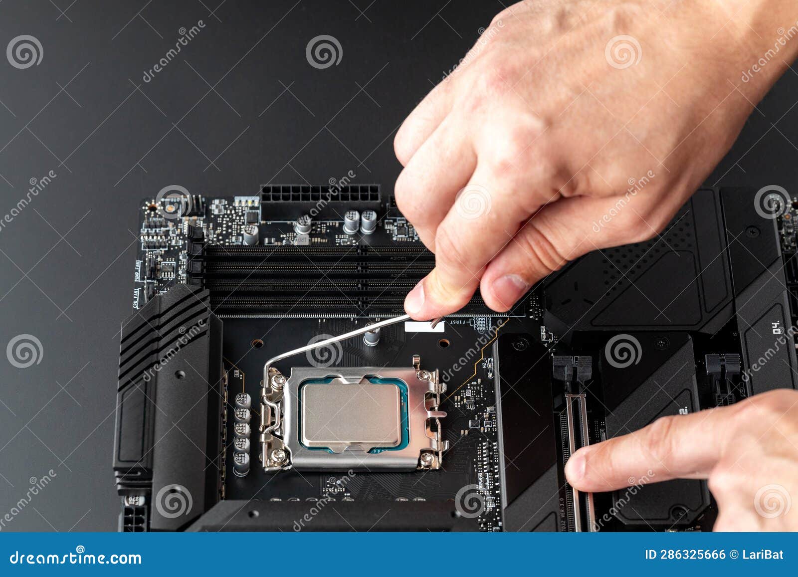 Computer CPU Installation. Hand of Master Installs Processor Chip on ...