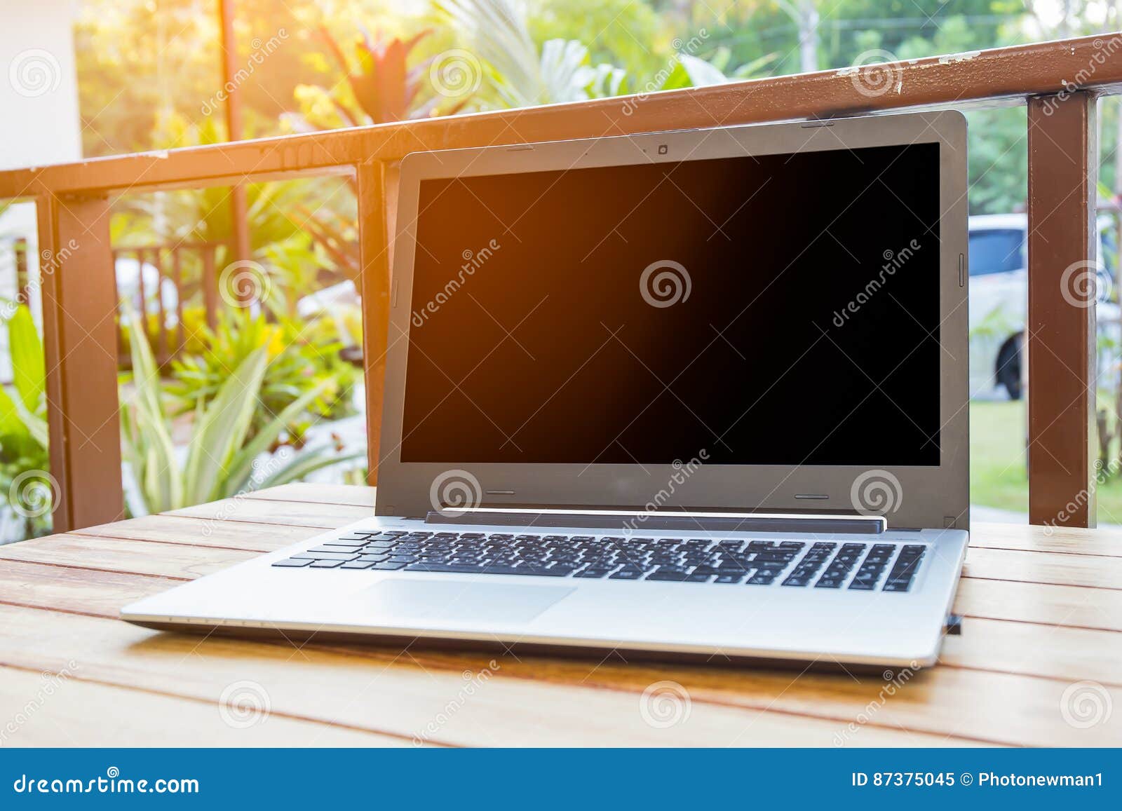 Computer on a Desk in a Sunny Garden. Stock Image - Image of laptop ...