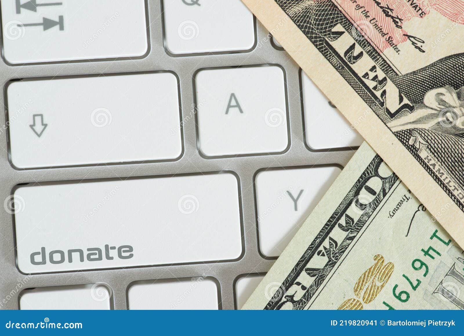 A Computer, Dollar Bills and Key for Donations Stock Image - Image of ...