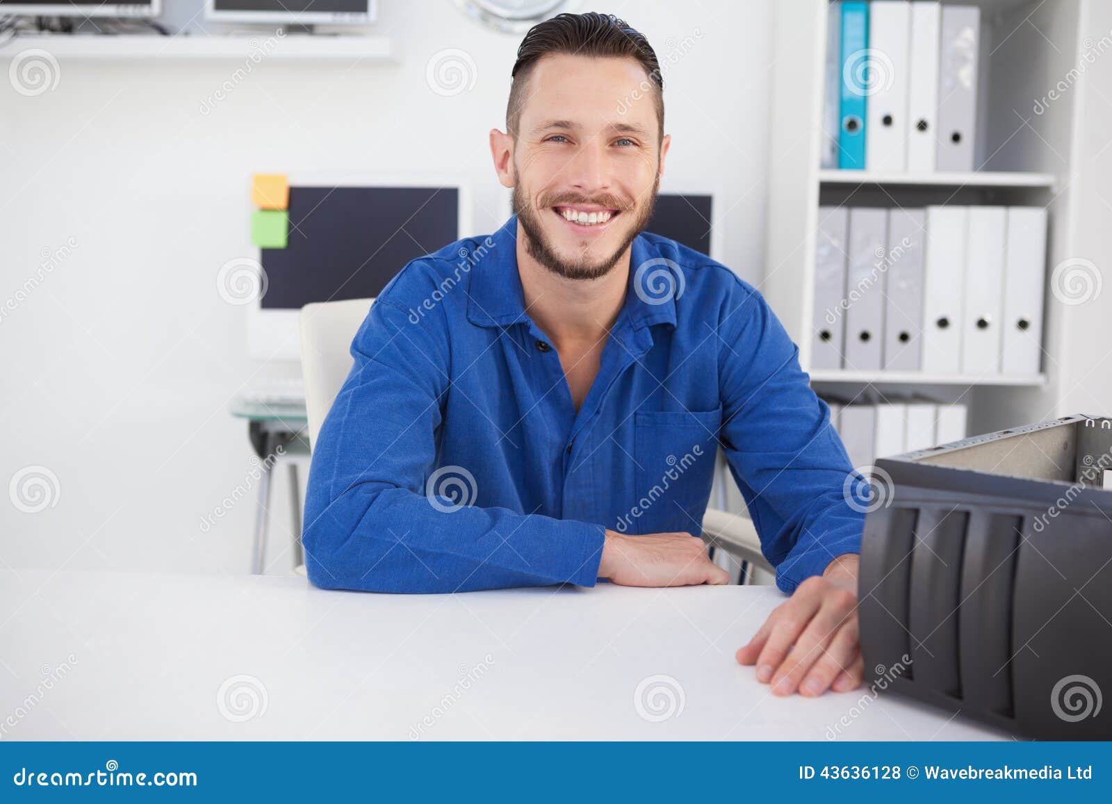 Computer Engineer Sitting at Desk Smiling at Camera Stock Photo - Image ...