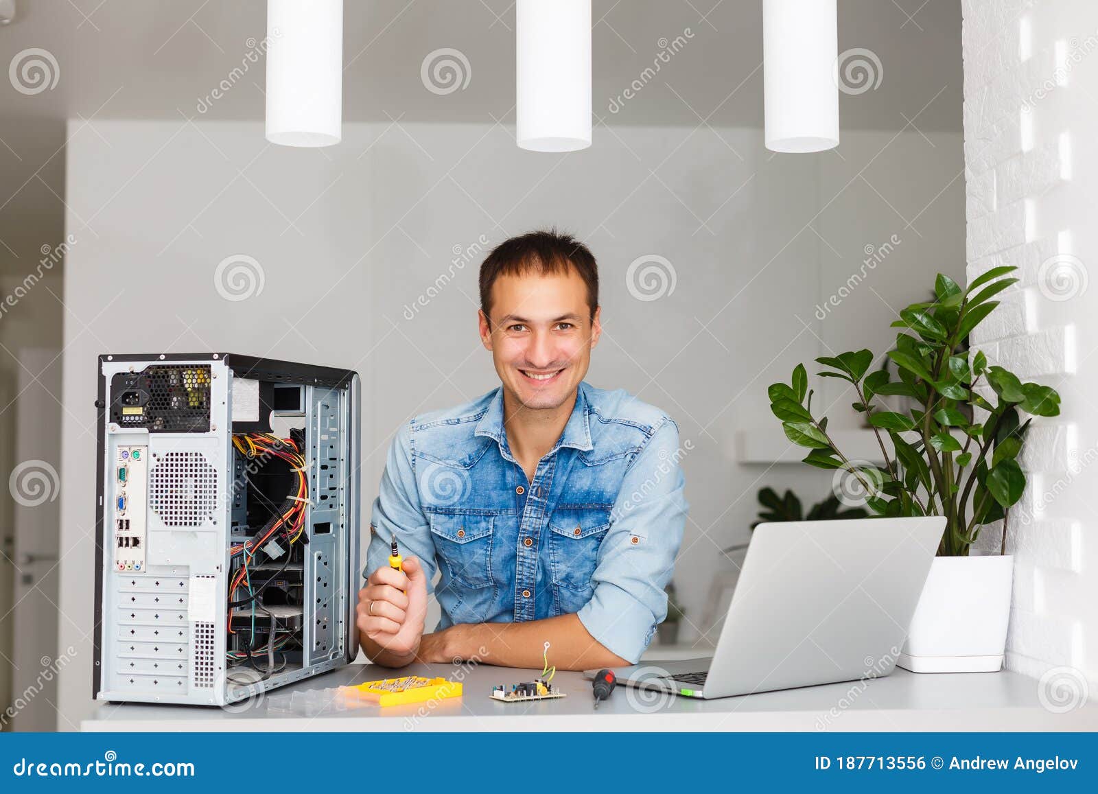 Computer Engineer Working on Broken Console in His Office Stock Photo ...