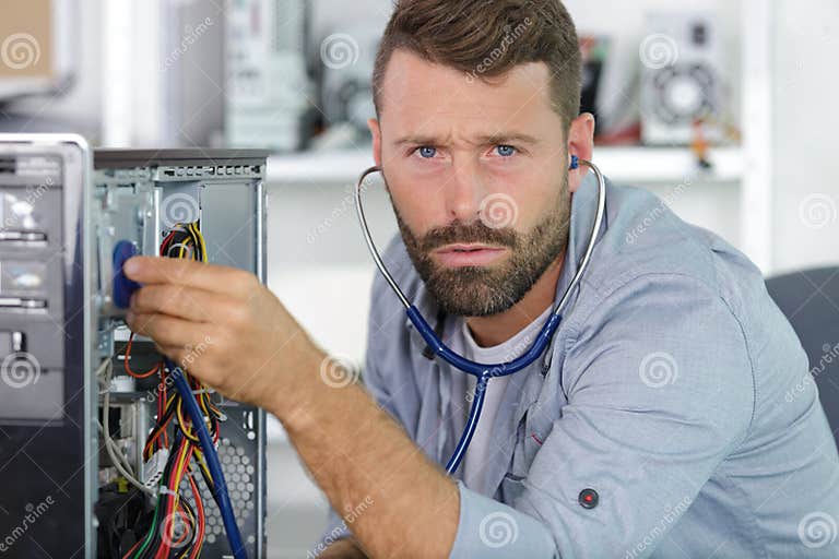 Computer Engineer Working on Broken Console in Office Stock Photo ...