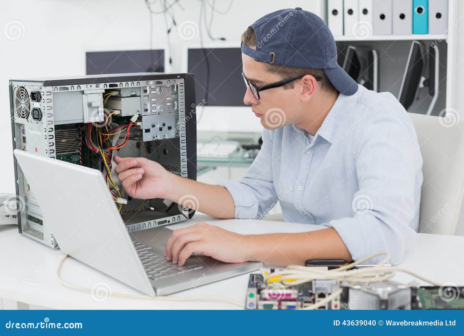 Computer Engineer Working on Broken Console with Laptop Stock Photo ...