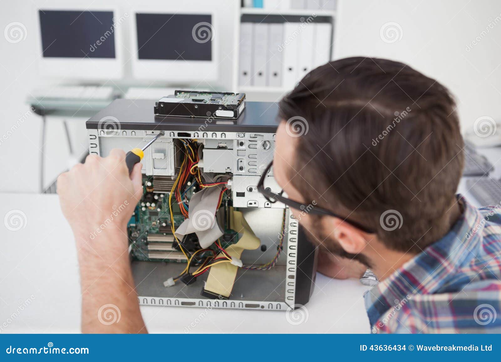 Computer Engineer Working on Broken Console with Screwdriver Stock ...
