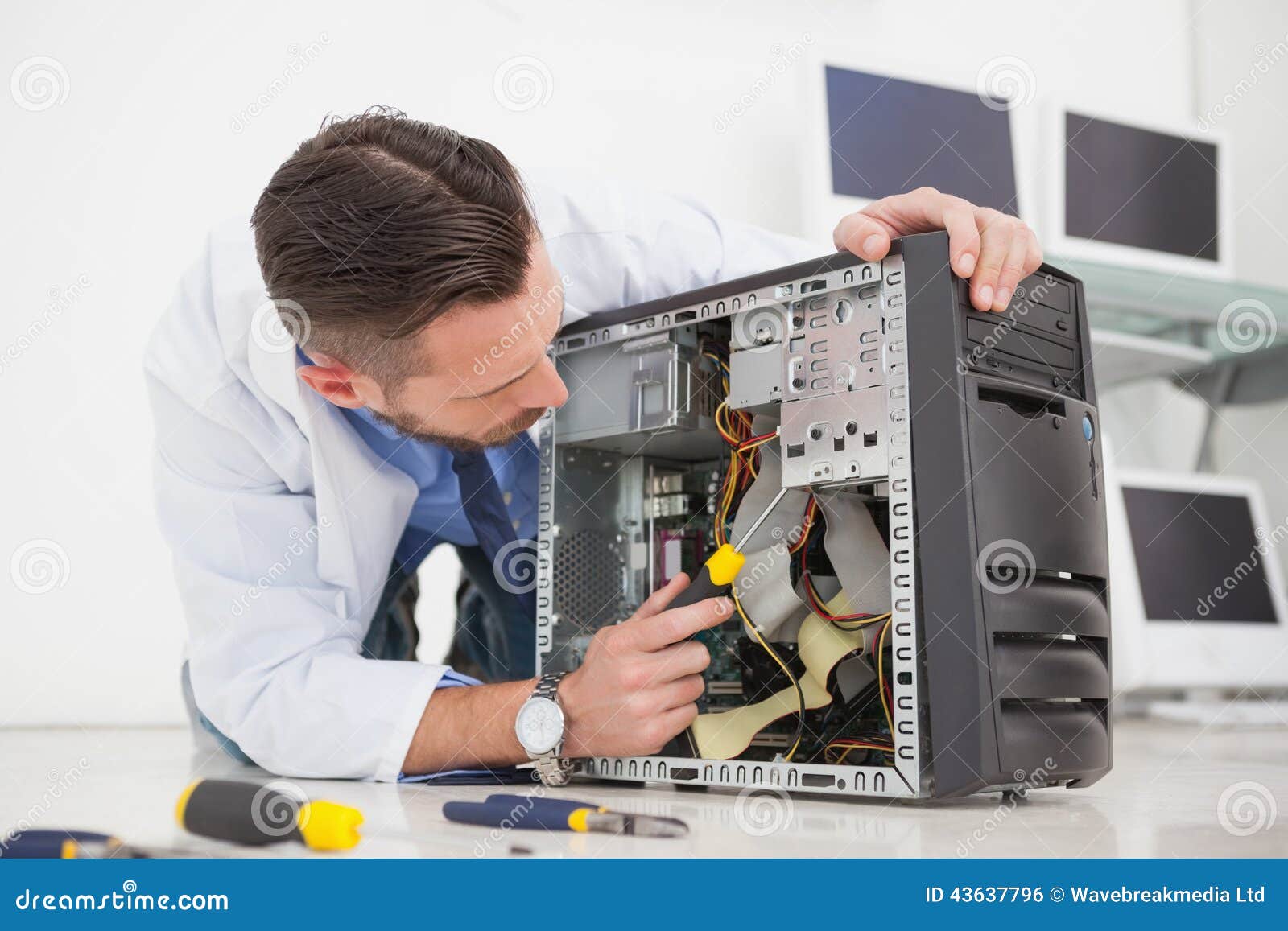 Computer Engineer Working on Broken Console with Screwdriver Stock ...