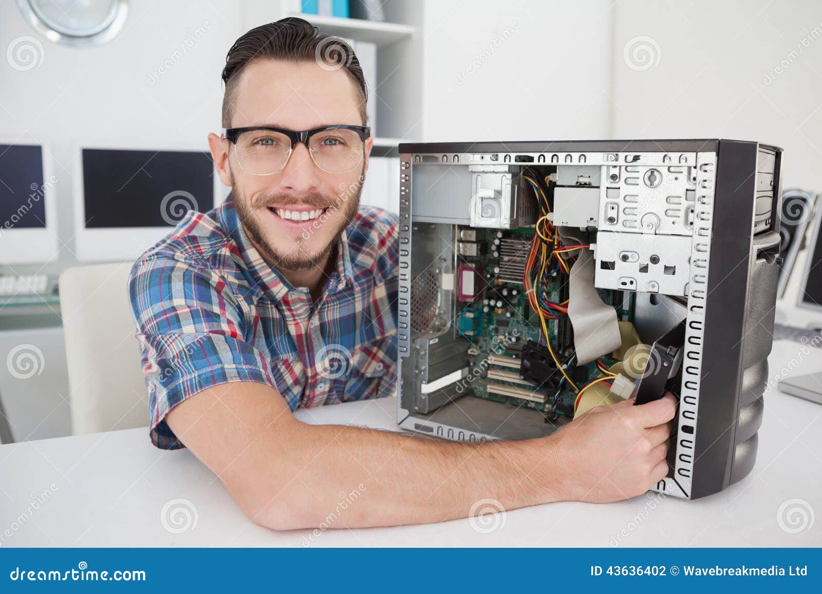 Computer Engineer Working on Broken Console Smiling at Camera Stock ...