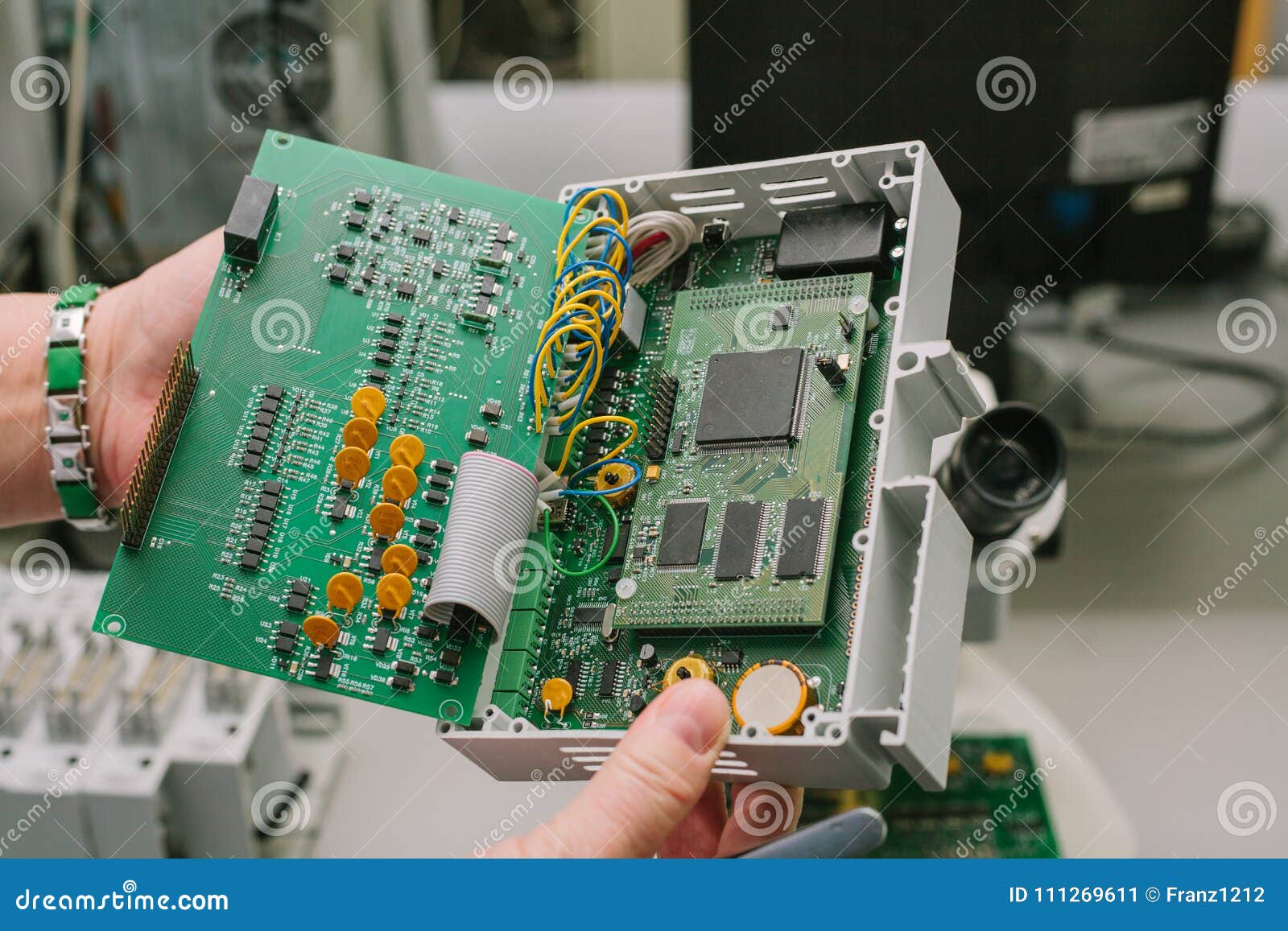 Computer Expert Professional Technician Examining Board Computer in a ...
