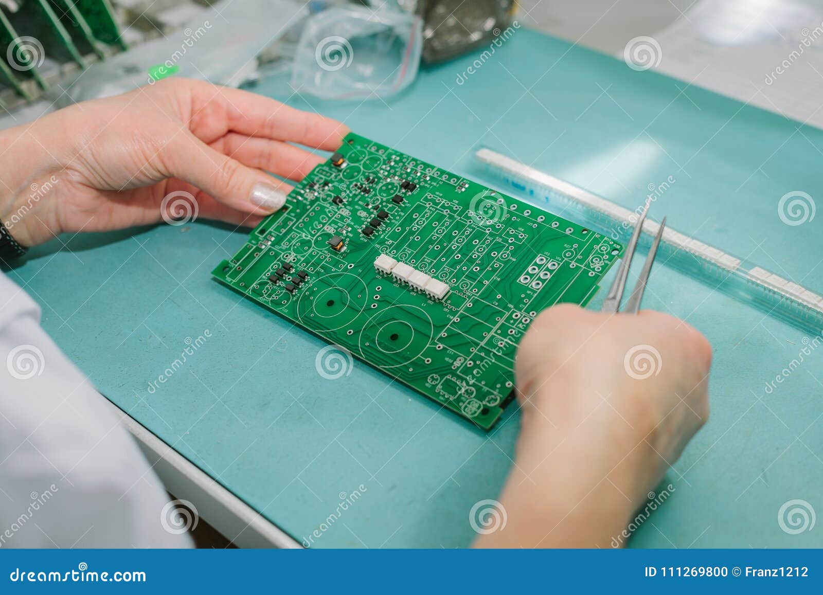 Computer Expert Professional Technician Examining Board Computer in a ...