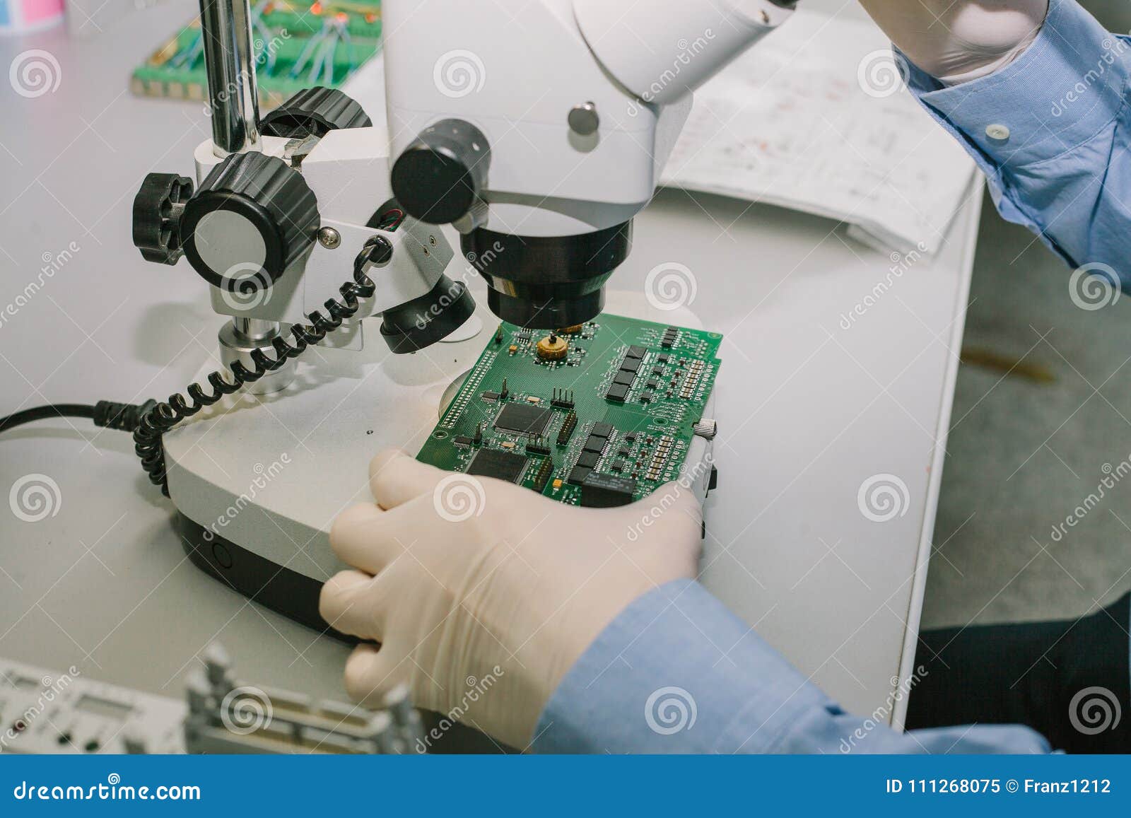 Computer Expert Professional Technician Examining Board Computer in a ...