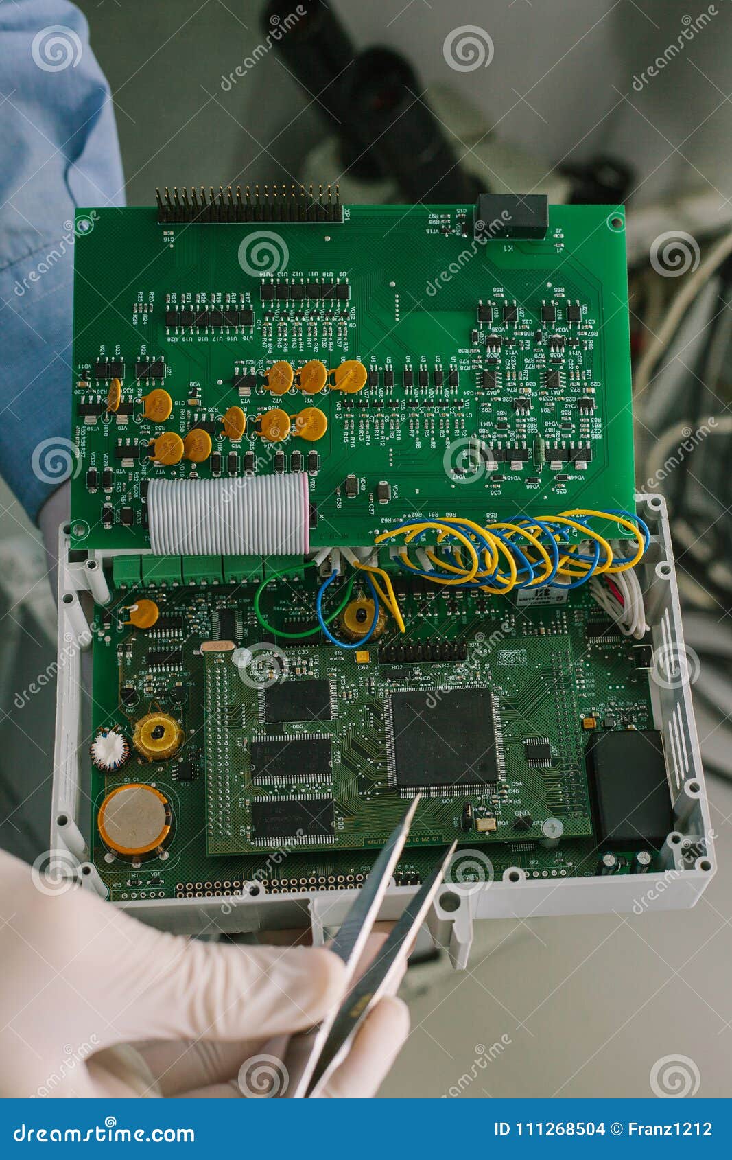 Computer Expert Professional Technician Examining Board Computer in a ...