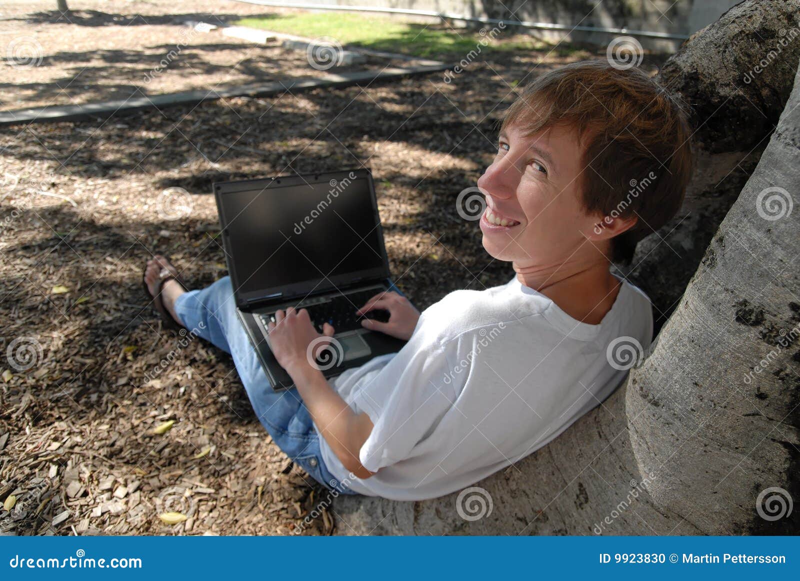 Computer Guy Working Outside on Laptop Under Tree Stock Photo - Image ...
