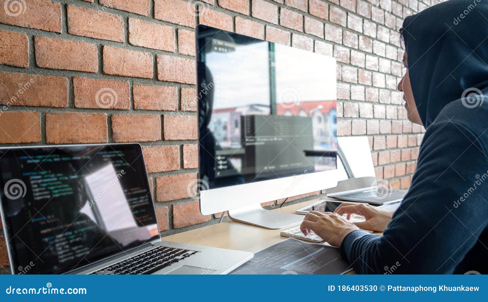 Computer Hacker or Cyber Attack Concept, Dangerous Hooded Hacker Using Multiple Computers Typing ...