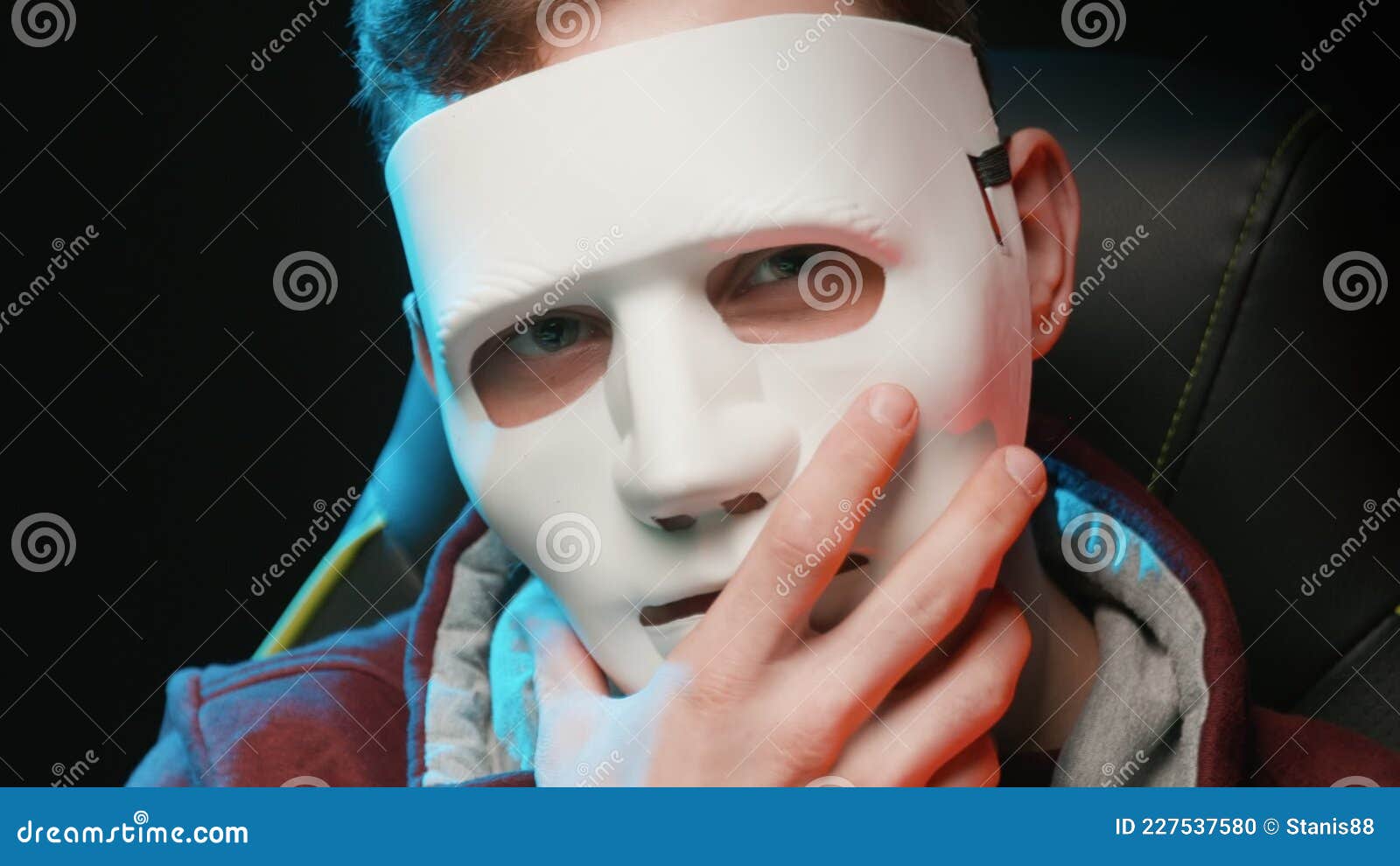 The Guy Takes Off the Mask from His Face and Looks at the Camera Close ...