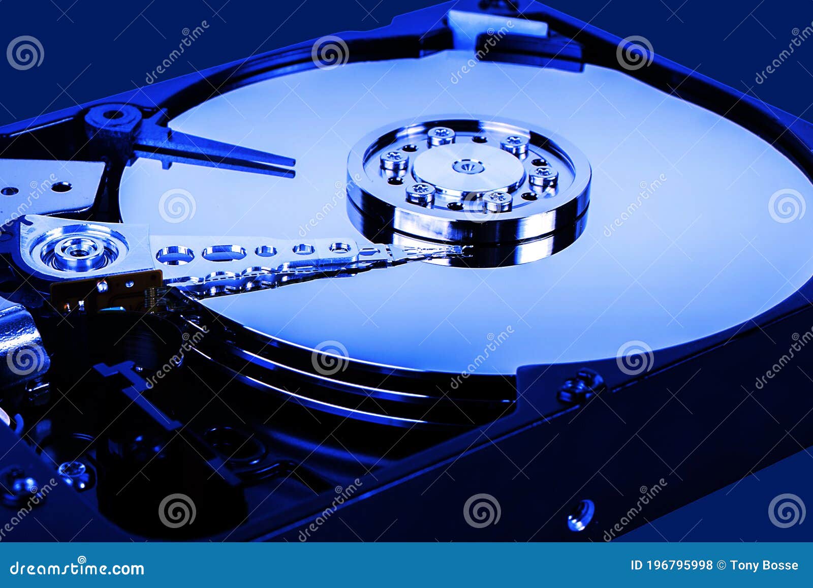 Computer Hard Drive Closeup, Illuminated in Blue Stock Photo - Image of ...