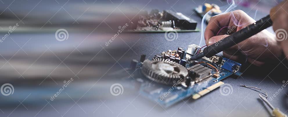 Computer Hardware Engineering. Engineer Soldering Computer Motherboard ...
