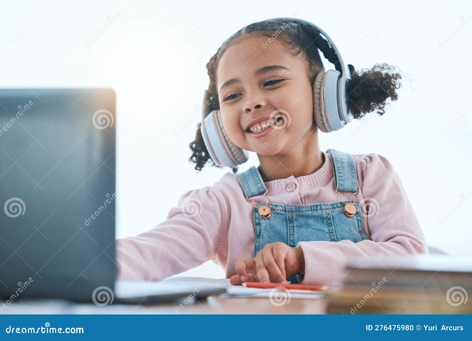 Computer, Headphones and Child Listening in Virtual Class for E ...