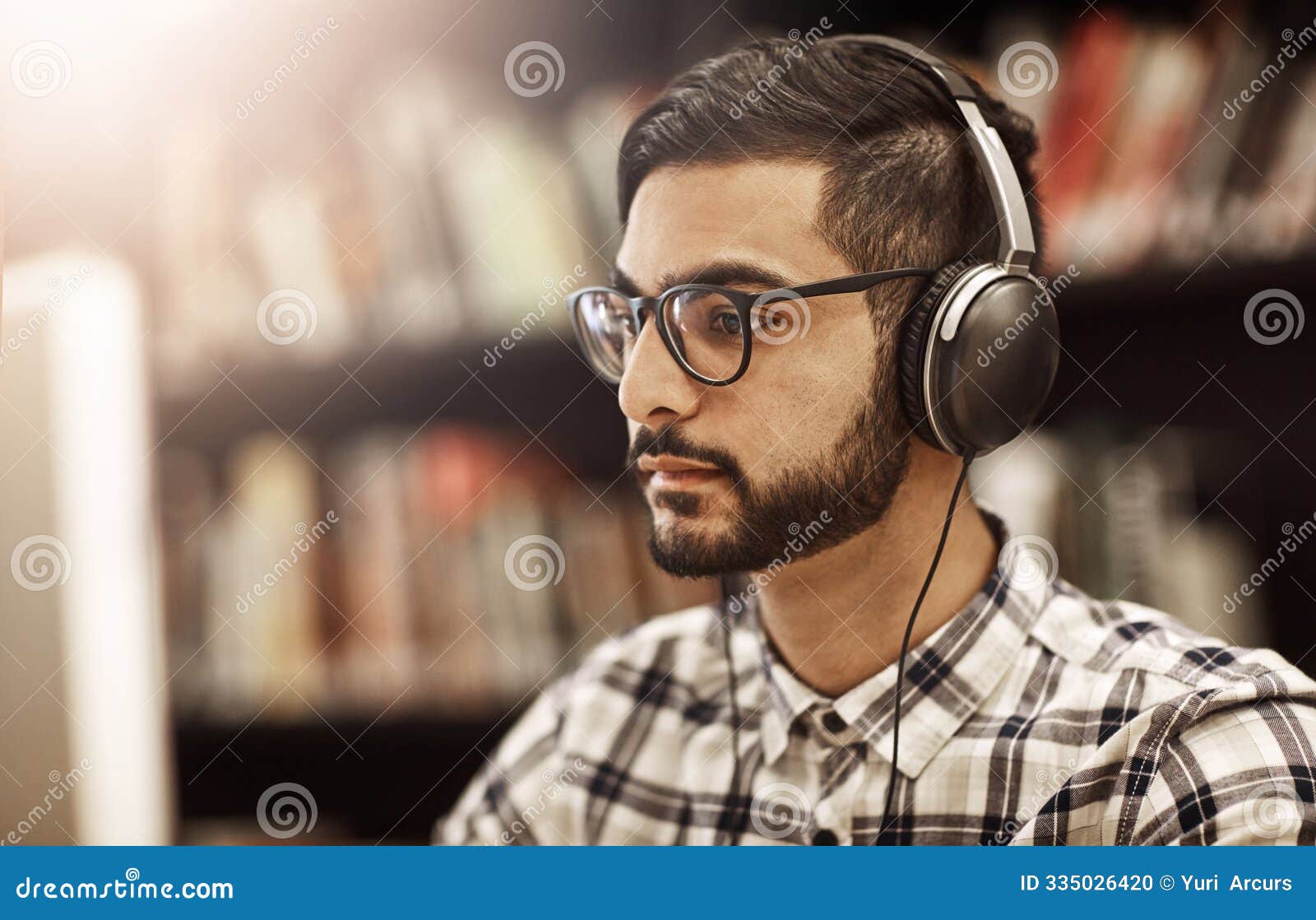 Computer, Headphones and Indian Man in Library for Reading, Elearning ...