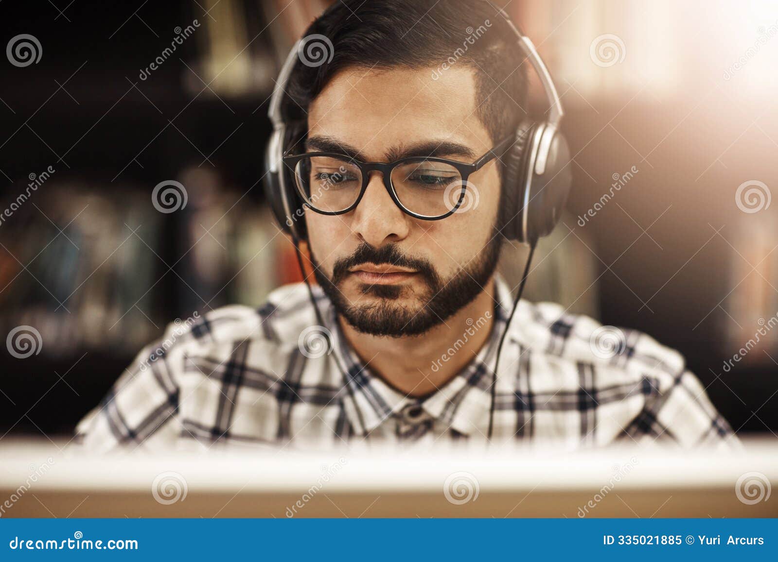 Computer, Headphones and Indian Man in Library for Research, Elearning ...