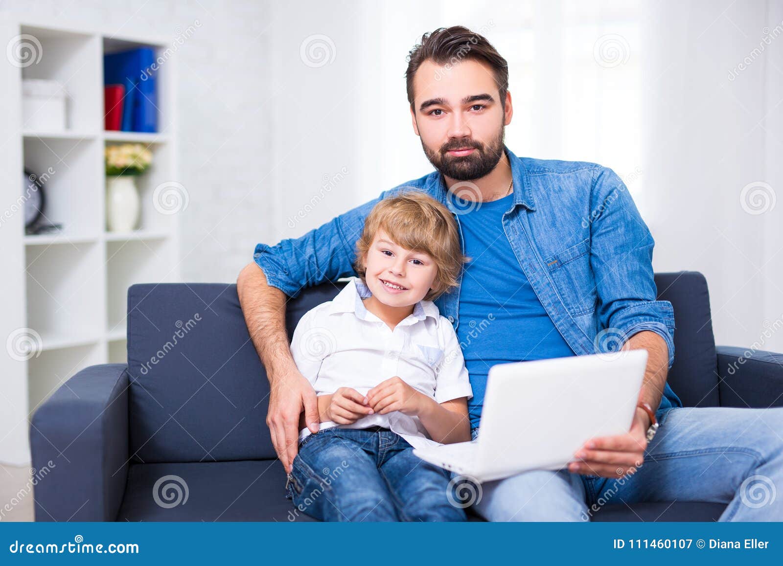 Computer and Internet Concept - Young Father and Little Son Using ...