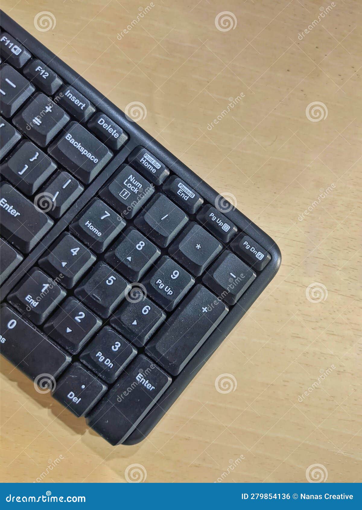 A Computer Keyboard on a Cream-colored Table with Black and White ...