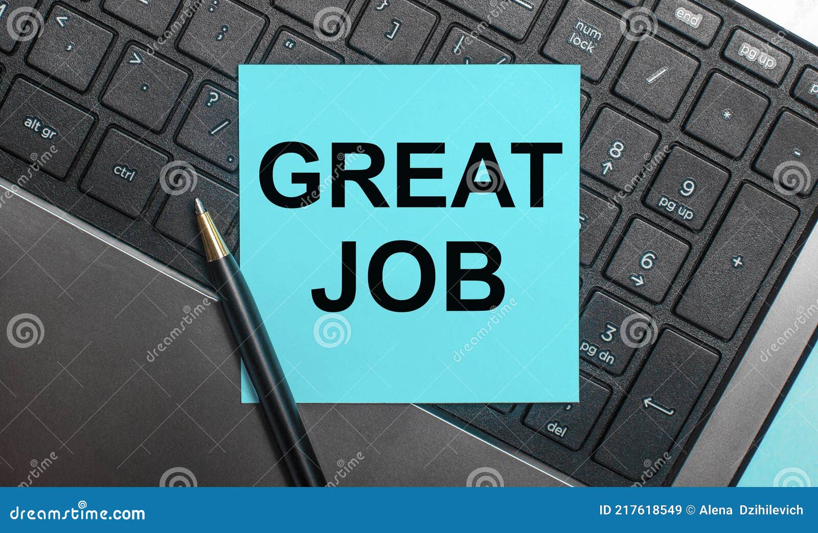 The Computer Keyboard Has a Pen and a Blue Sticker with the Text GREAT ...