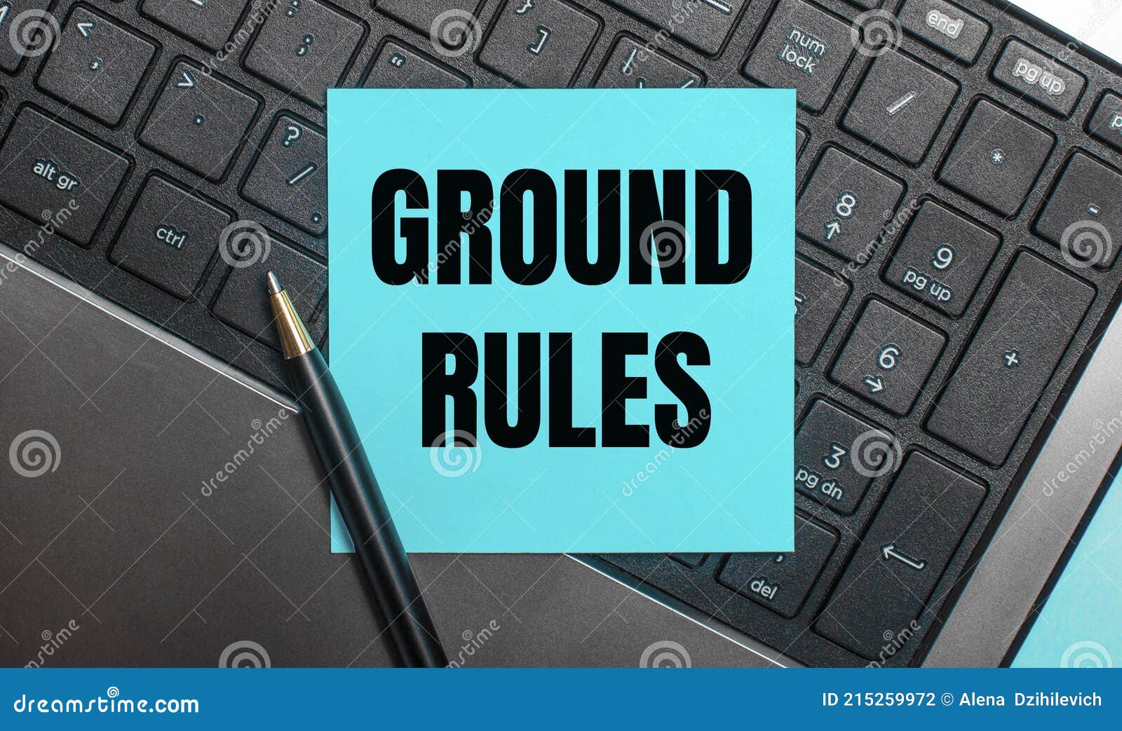 The Computer Keyboard Has a Pen and a Blue Sticker with the Text GROUND ...