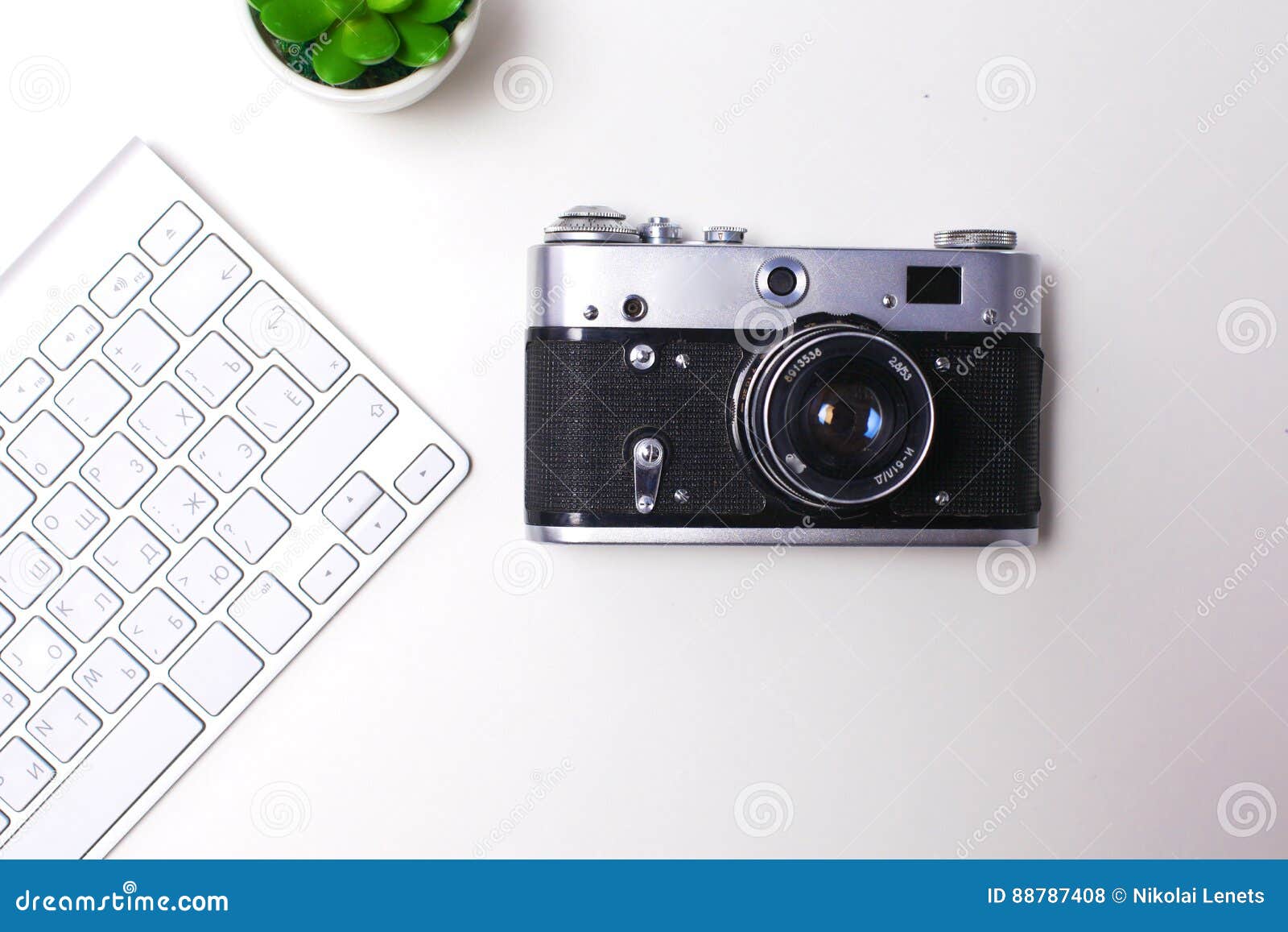 Computer Keyboard, Mouse and Camera Lie on a White Table Stock Photo ...