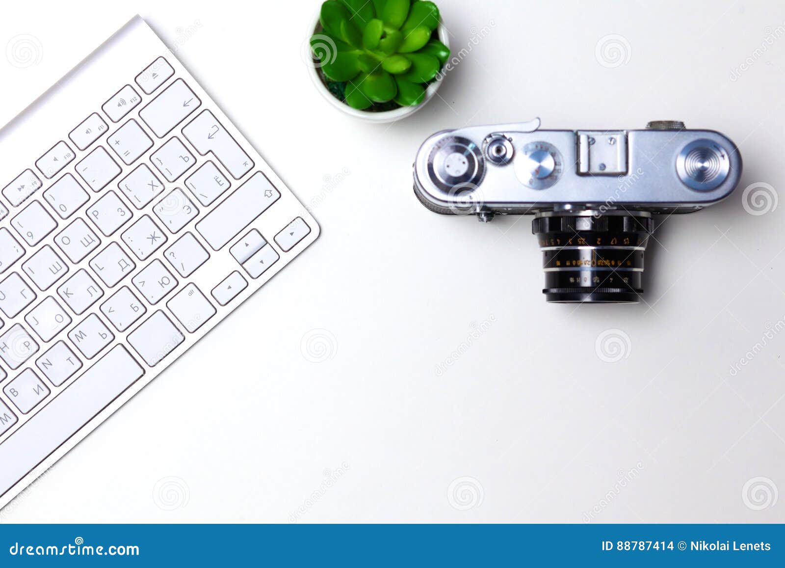 Computer Keyboard, Mouse and Camera Lie on a White Table Stock Photo ...